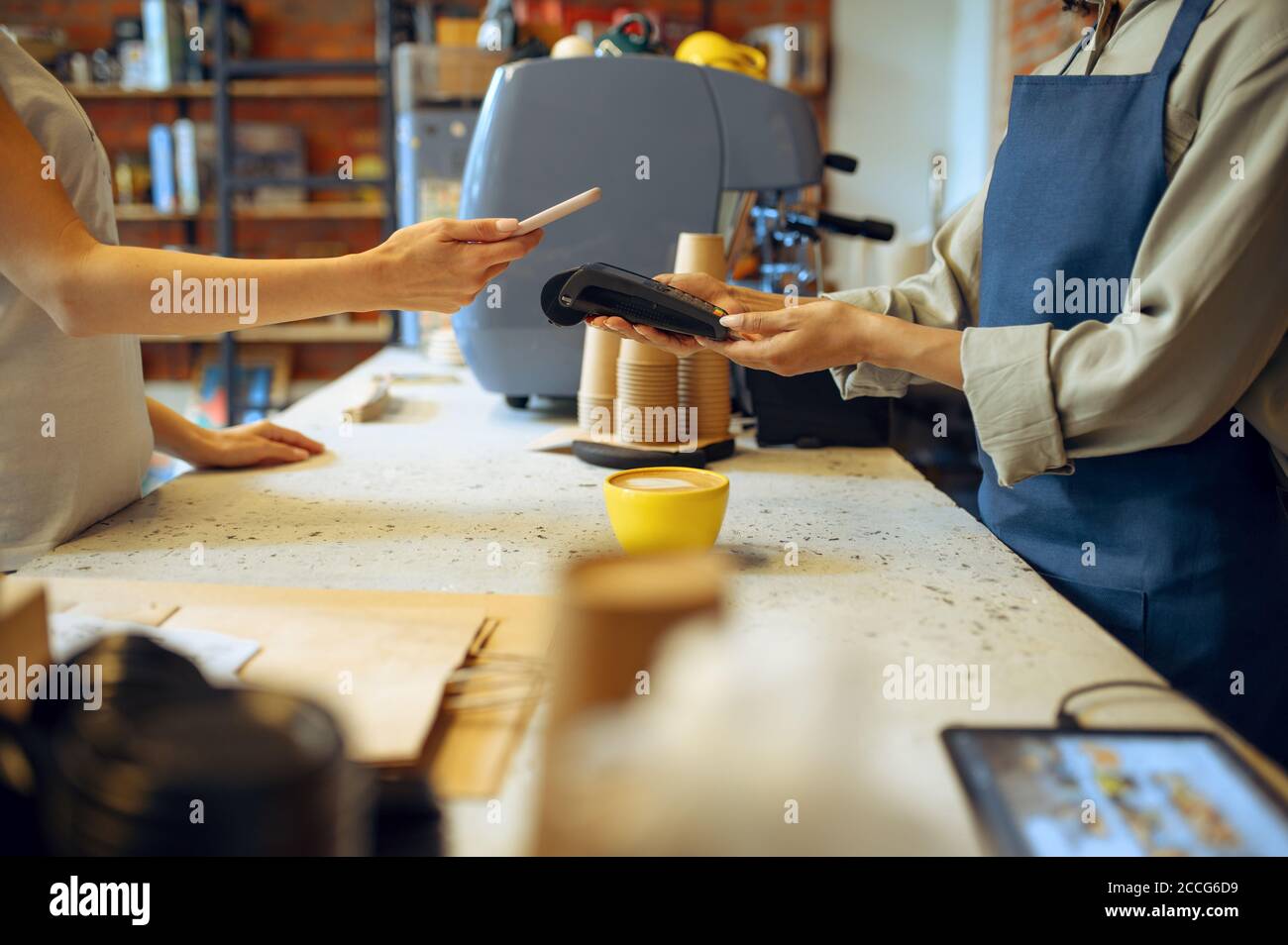 Male female barista holding hi-res stock photography and images - Alamy