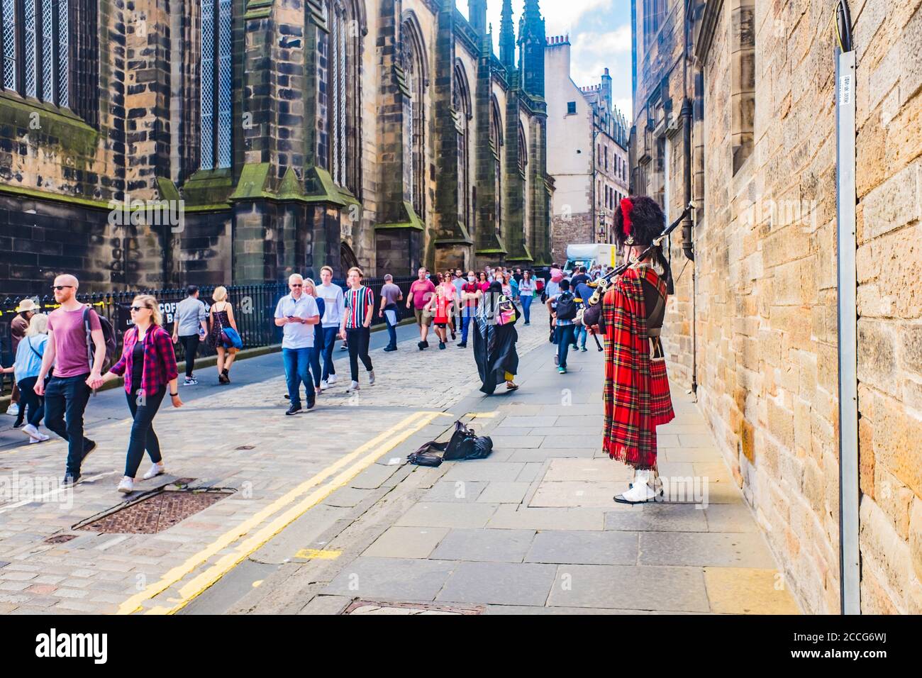Edinburgh Scotland 6th Aug 2020 Bagpipe player on ancient Royal Mile. Medieval Old Town ...