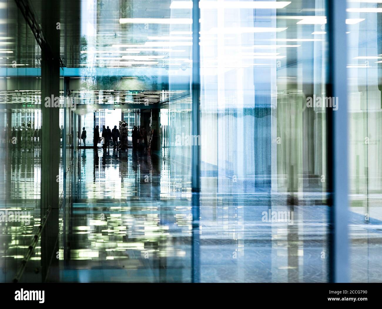 Office corridor reflections with silhouettes Stock Photo - Alamy