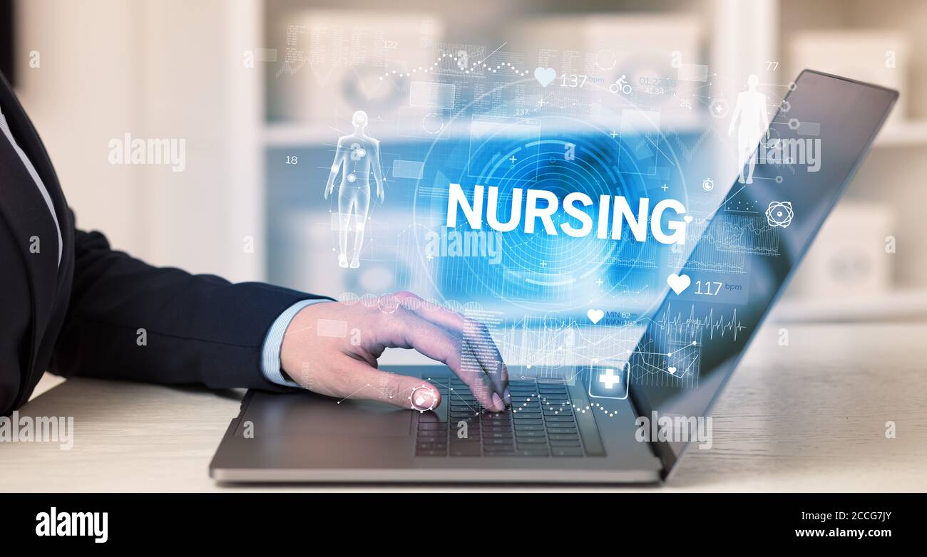 Doctor working a health check with NURSING inscription, recording ...