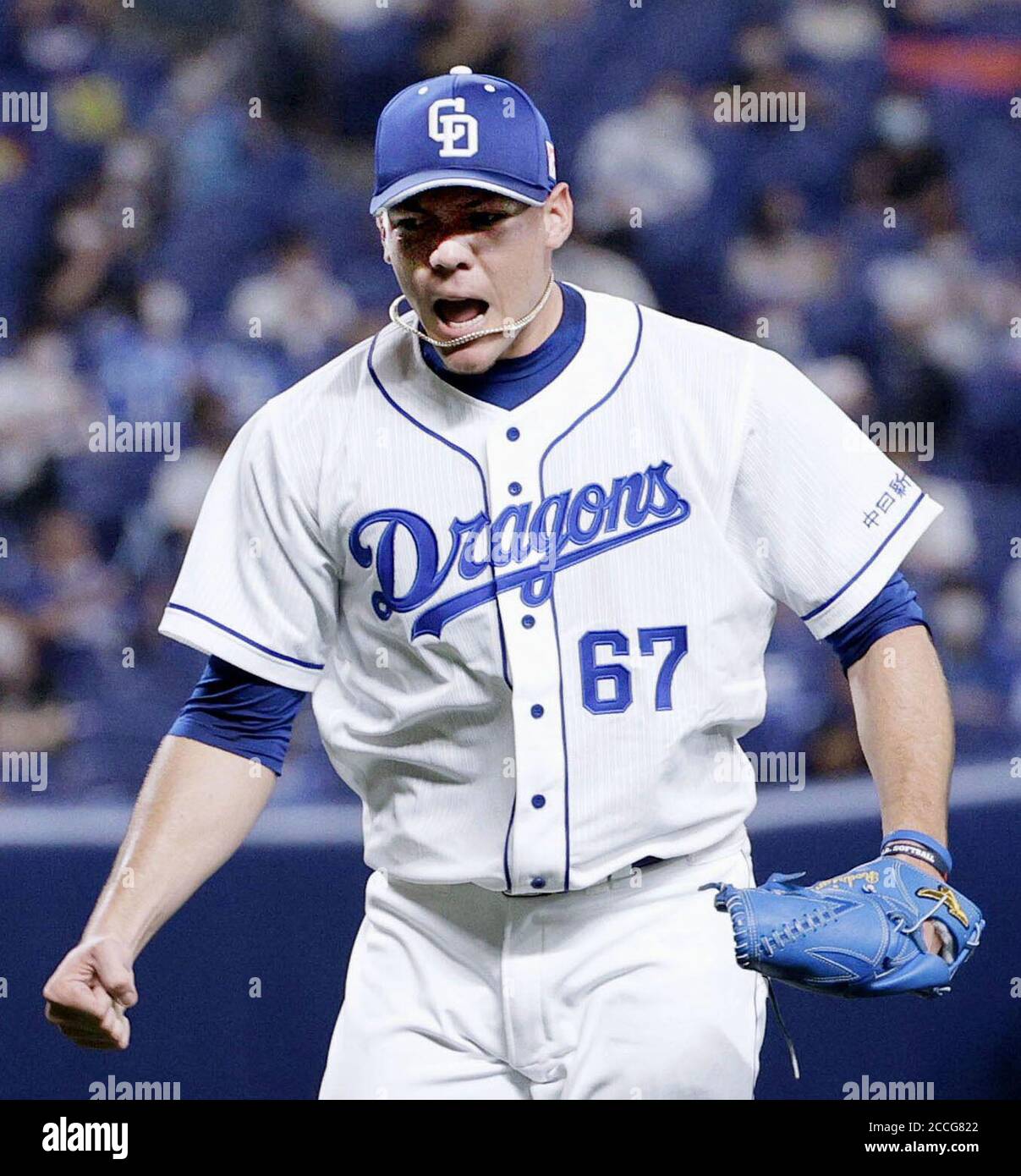 Chunichi Dragons pitcher Yariel Rodriguez reacts after escaping a two ...