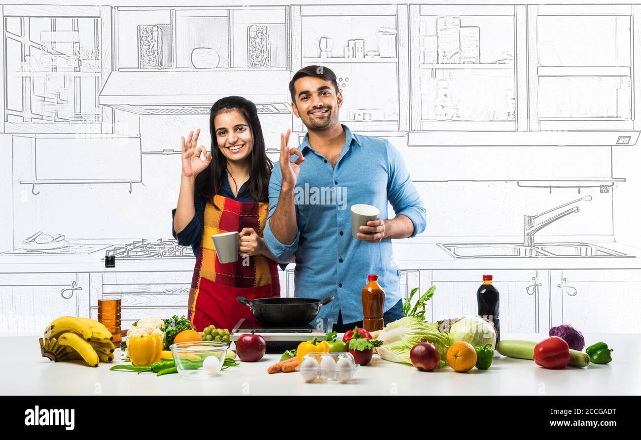 Indian couple fun kitchen hi-res stock photography and images - Alamy