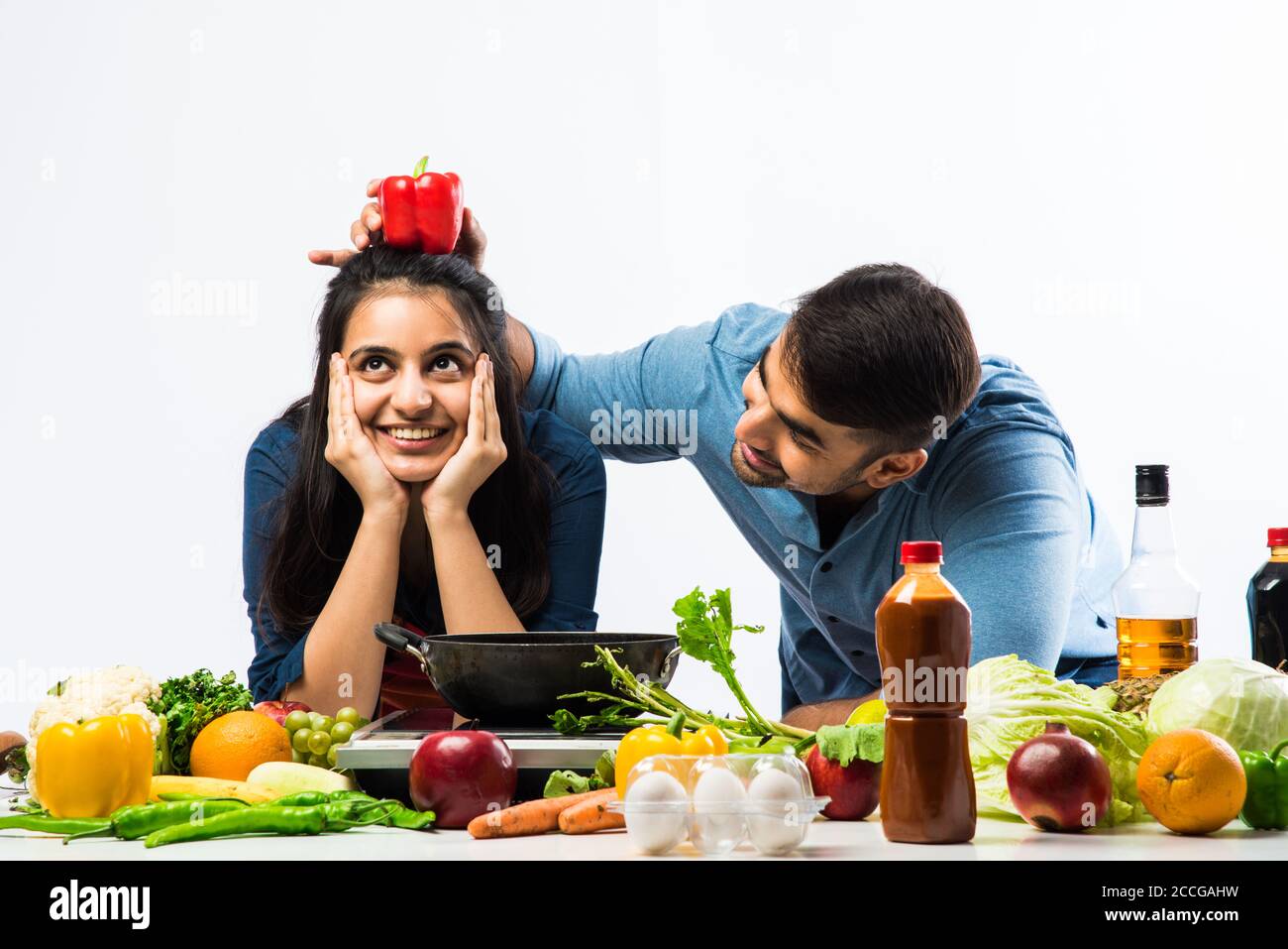 Indian couple in kitchen - Young Beautiful asian wife enjoying cooking ...