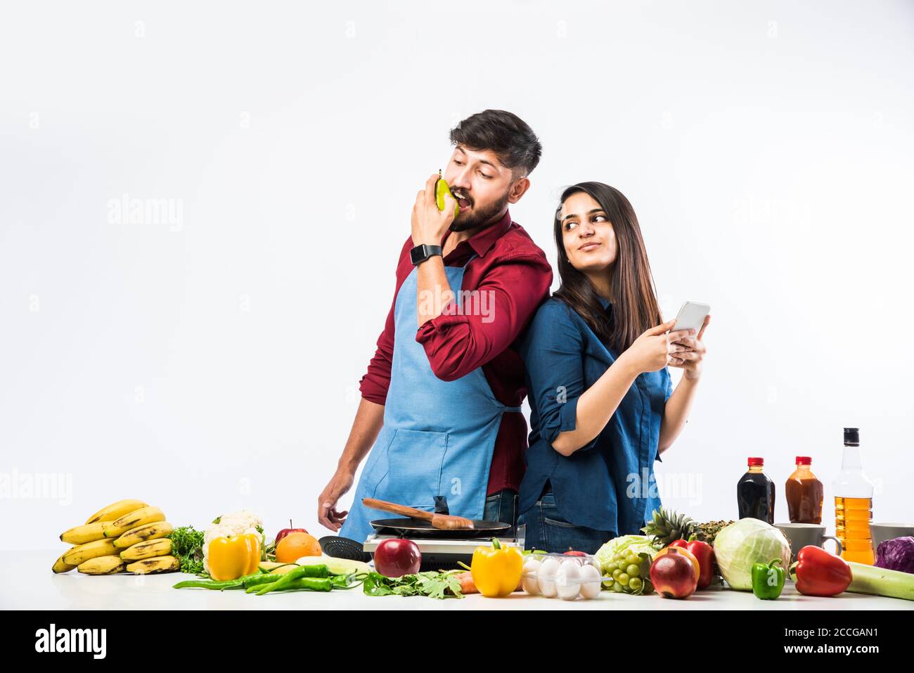 Indian Couple In Kitchen Young Beautiful Asian Wife Enjoying Cooking With Husband With Lots Of