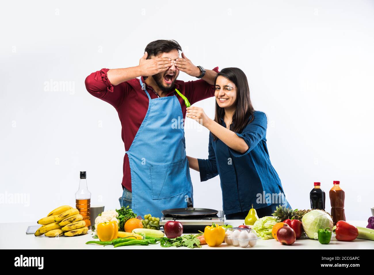Indian couple in kitchen - Young Beautiful asian wife enjoying cooking ...