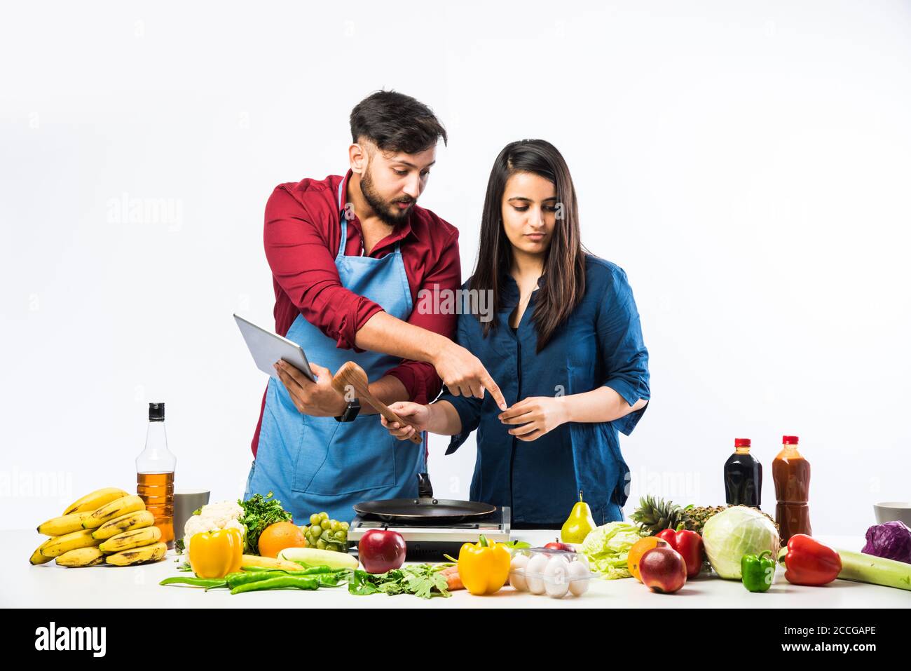 Indian girl cooking hi-res stock photography and images - Alamy