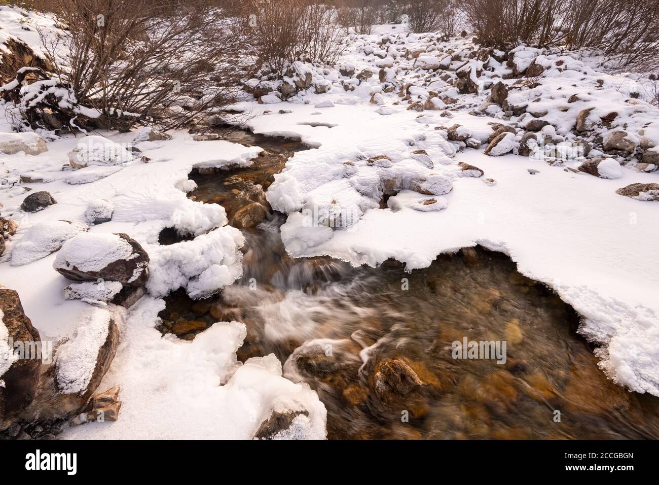 Stream with rapids in the so-called cow escape in winter with snow and ...
