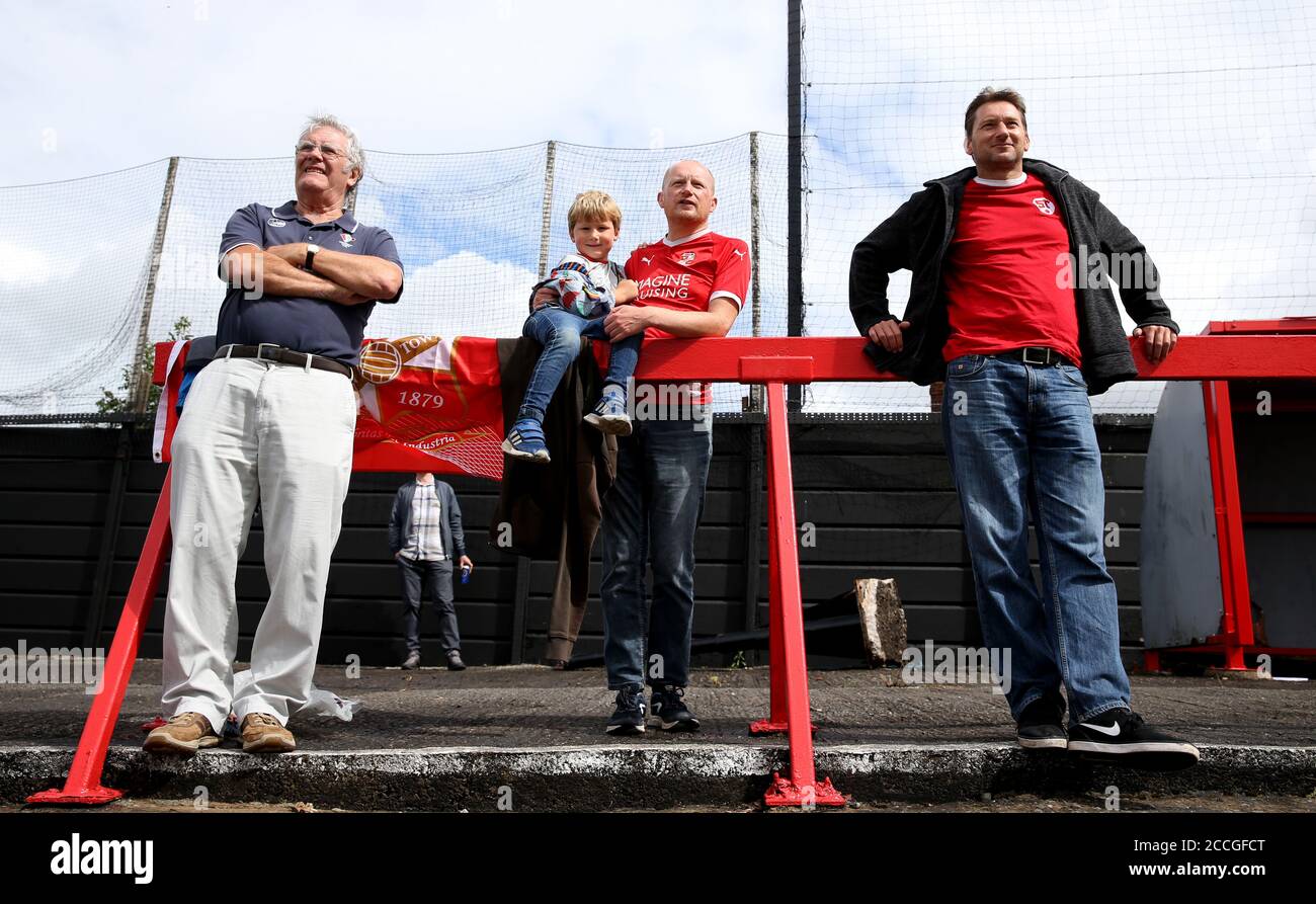 Swindon Town fans watch the pre-season friendly match at Hurst Cross ...