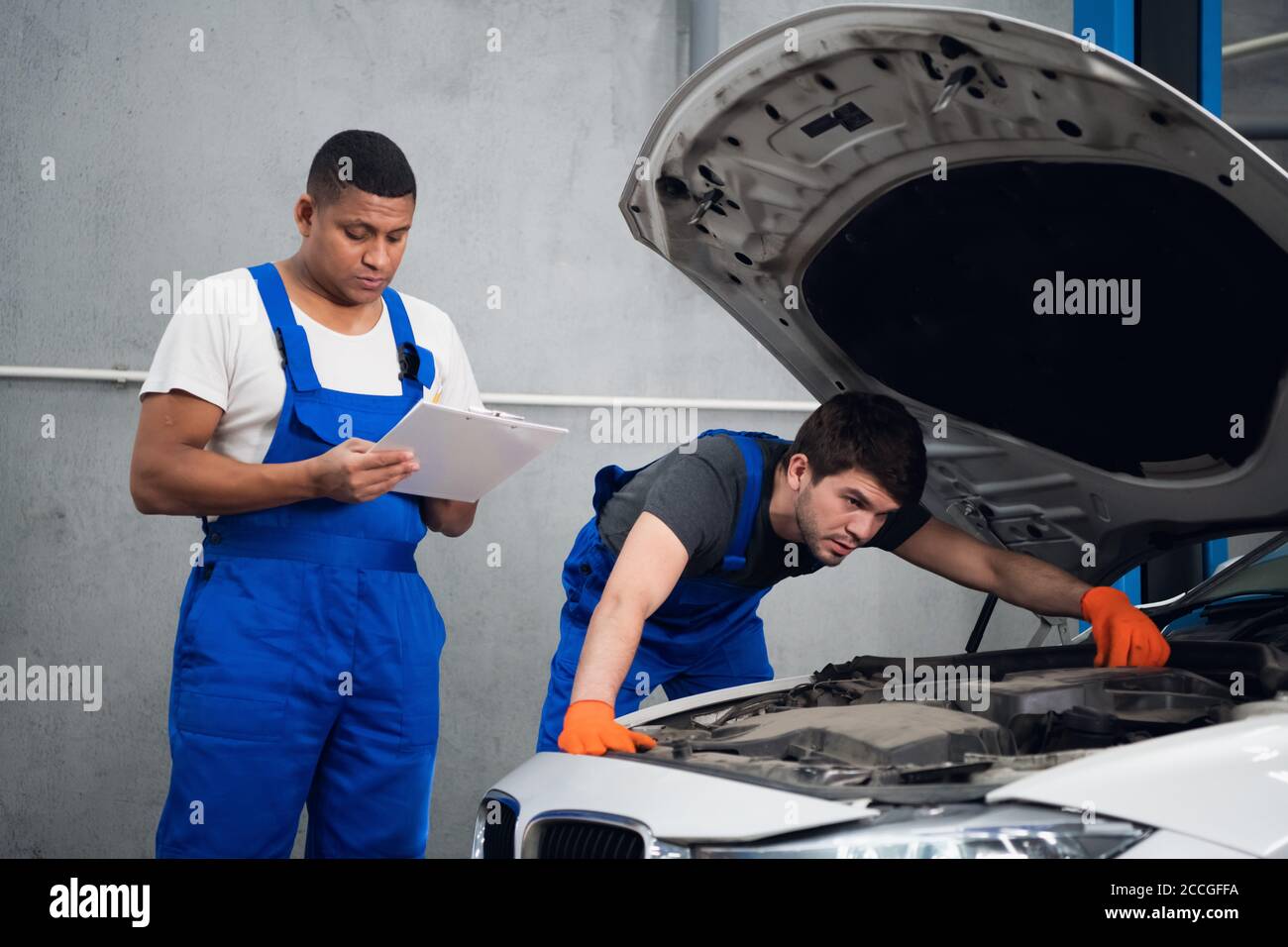 Two men driving one car hi-res stock photography and images - Alamy