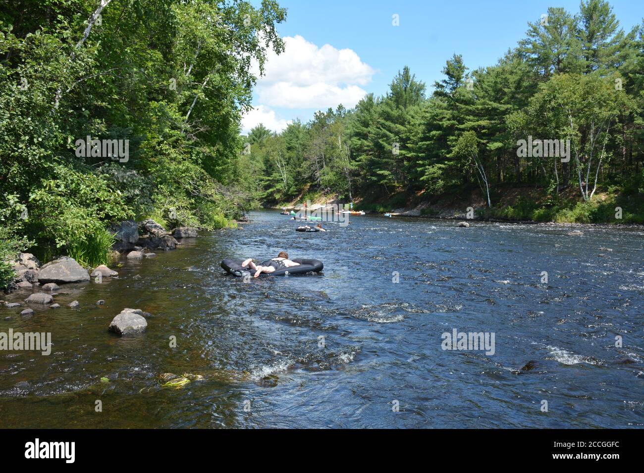 Kids enjoying tubing in rapids on the Mattawa River, Ontario Stock ...