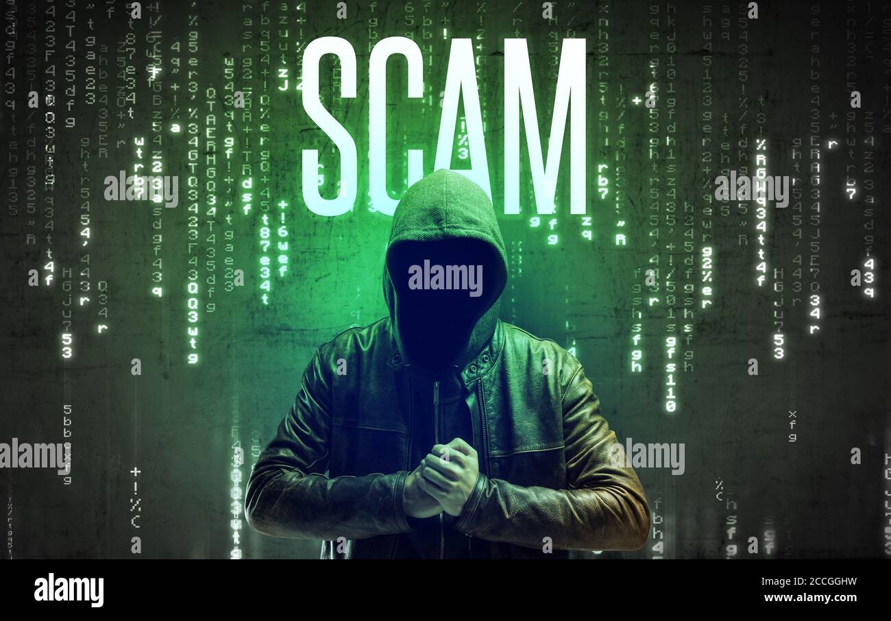 Faceless hacker with SCAM inscription, hacking concept Stock Photo - Alamy