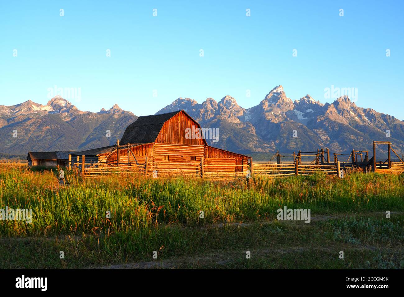 Sunrise over a log cabin on Mormon Row Historic District in Antelope ...