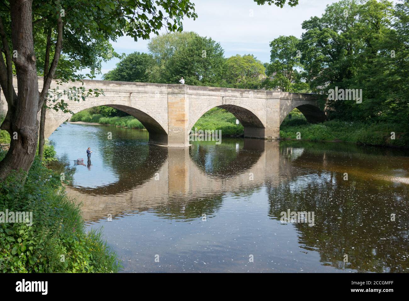 Summer view of the Georgian stone bridge over the River Wharfe at ...