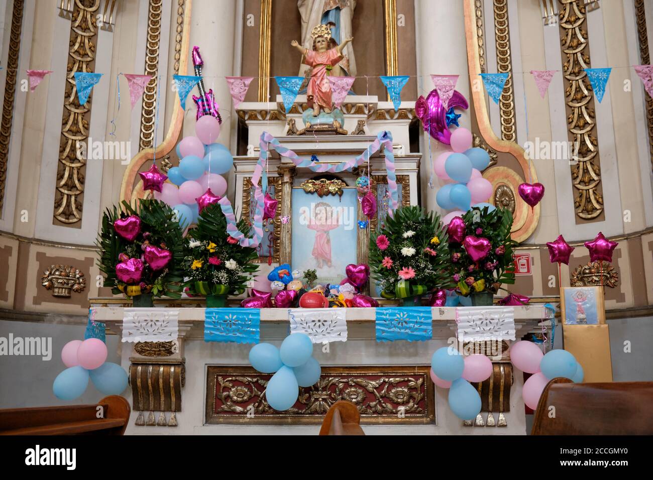Church alter to baby Jesus decorated with Christmas decorations and ...