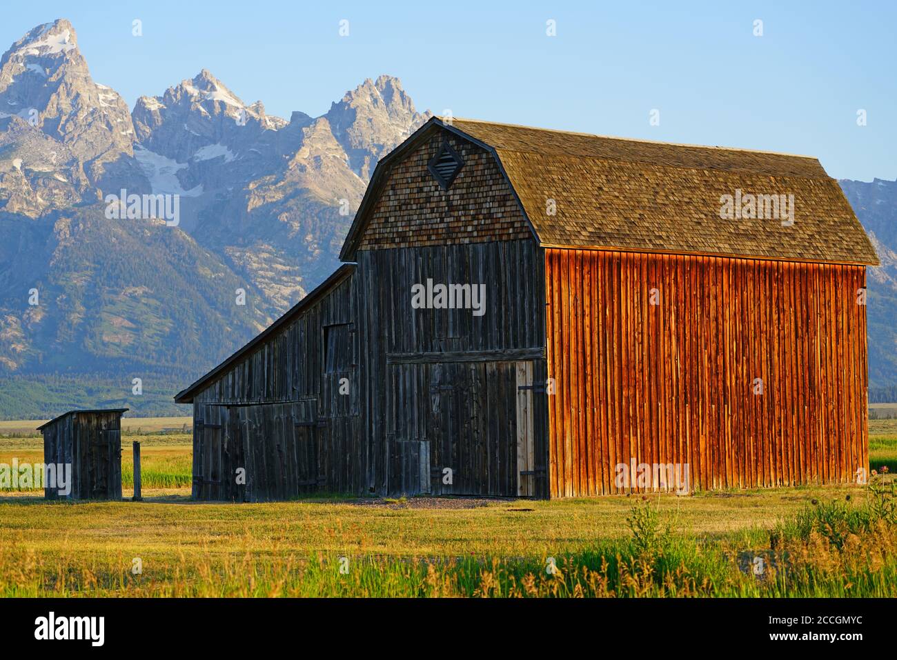 Sunrise over a log cabin on Mormon Row Historic District in Antelope ...