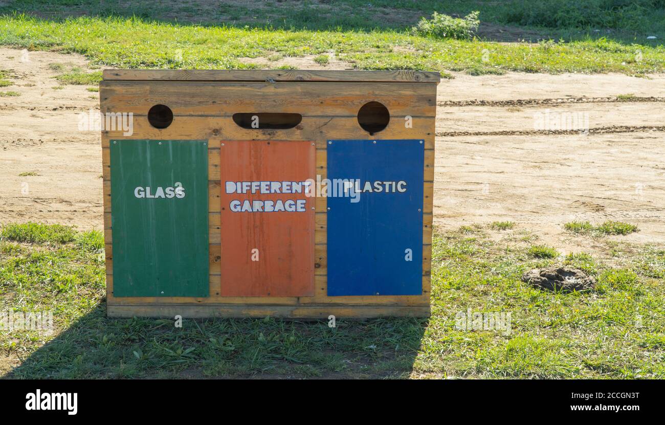 Containers for separate waste collection. wooden waste box on the ...