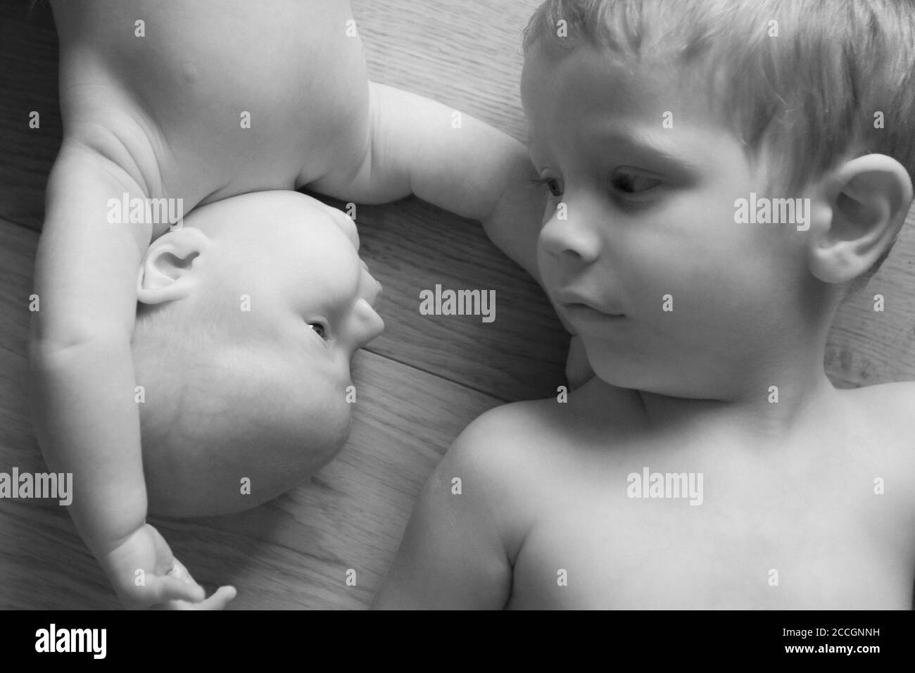 Changing another child Black and White Stock Photos & Images - Alamy