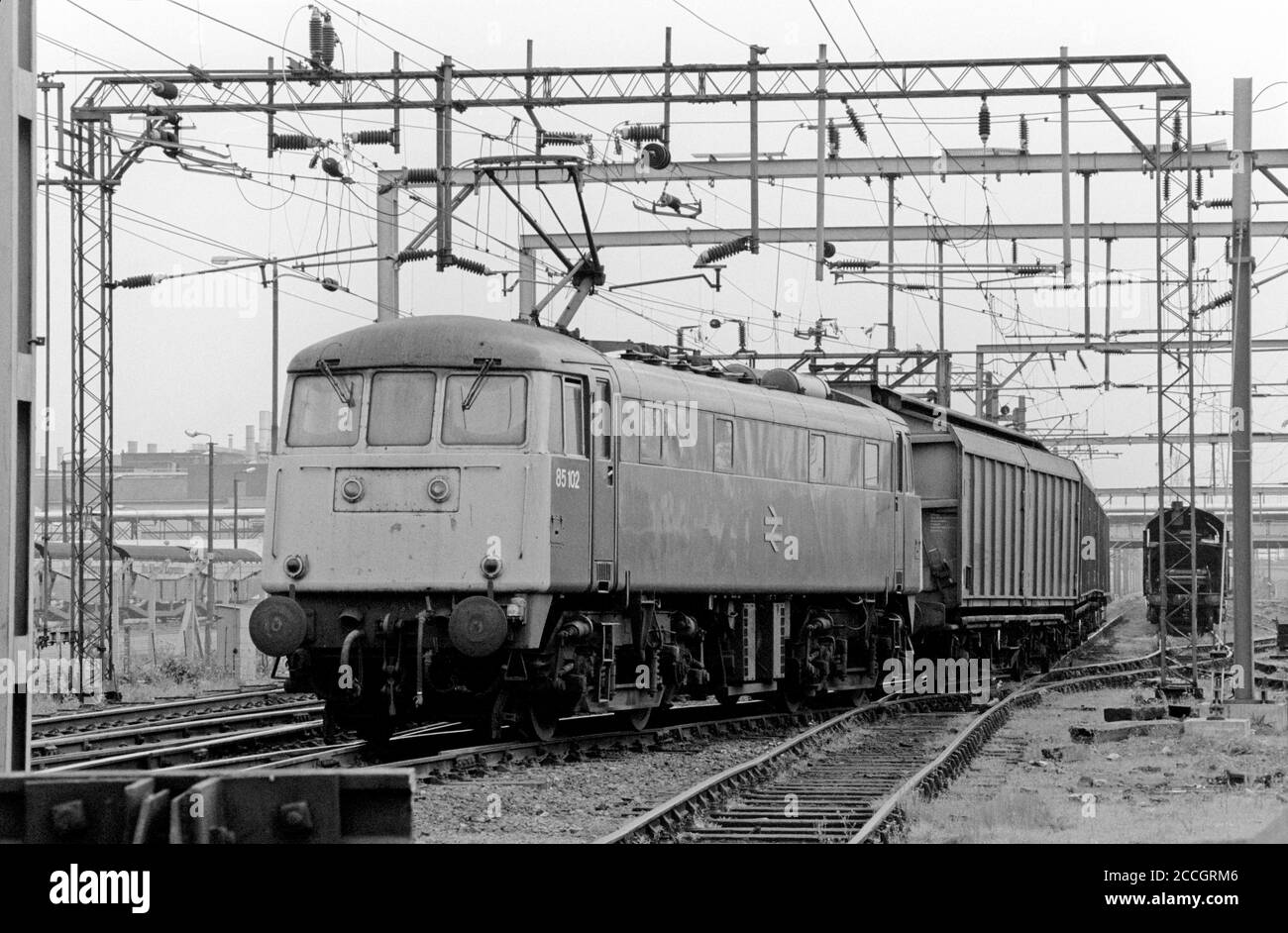 A Class 85 electric locomotive number 85102 departs Dagenham Dock with ...