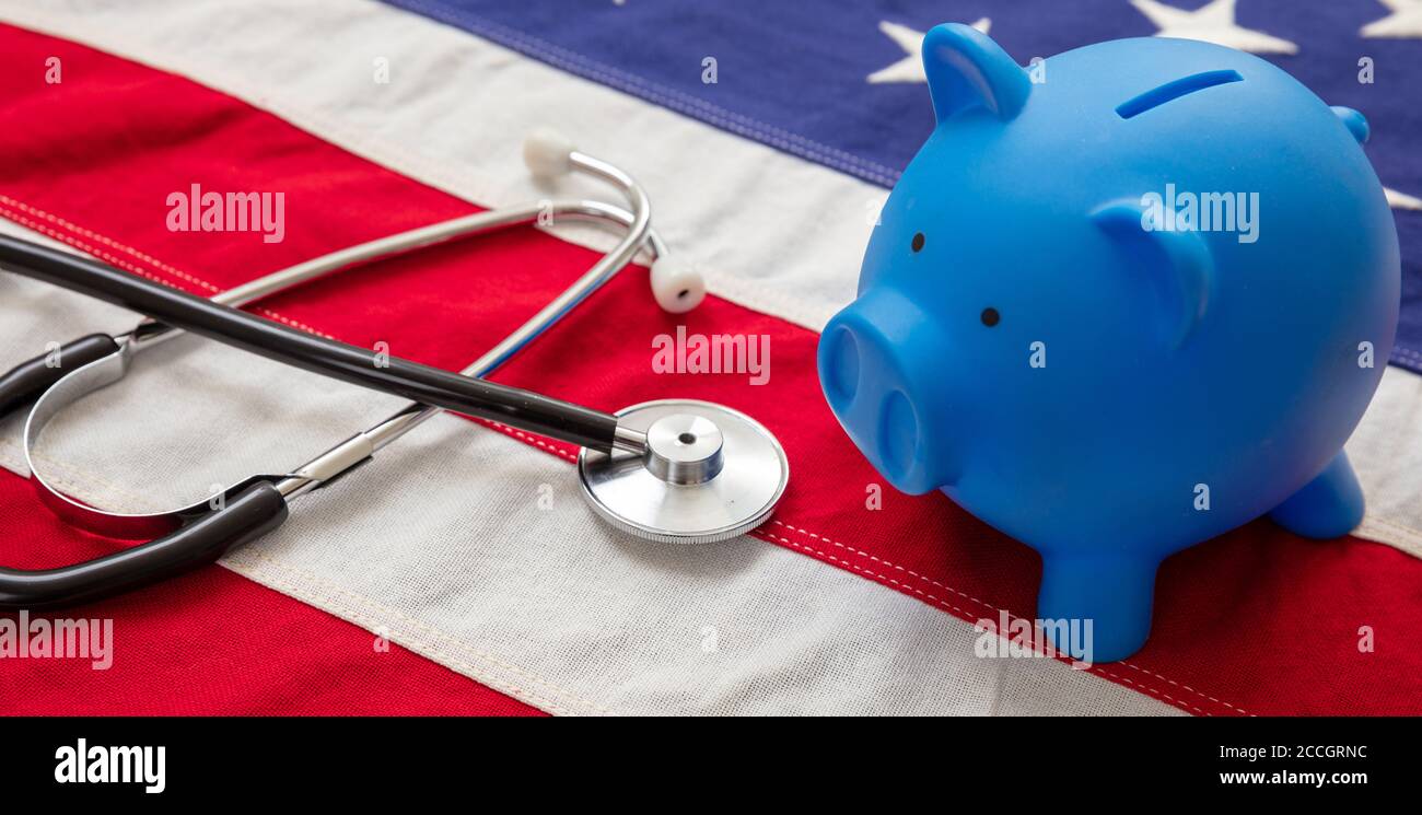 USA health care cost. Medical stethoscope and piggy bank on a US of ...