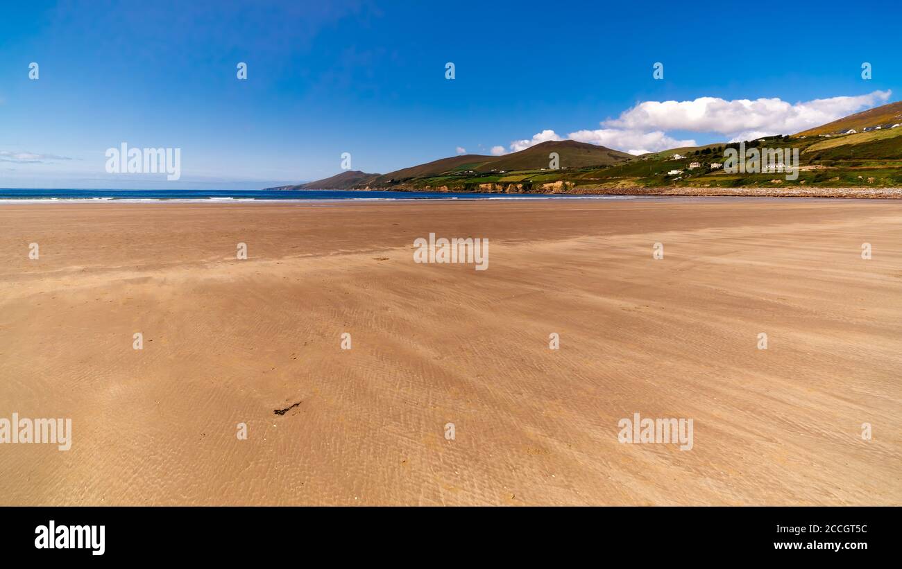 Long, beautiful sandy Inch Beach with mountains in background. Summer ...