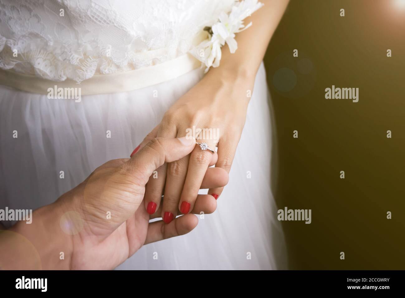 Wedding love couple concept : groom put wedding rings on bride finger ...