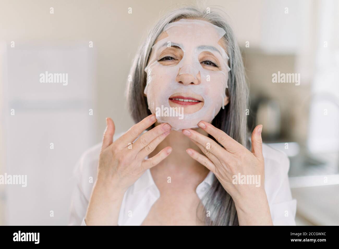 Head horizontal shot of smiling pretty senior lady enjoying morning ...