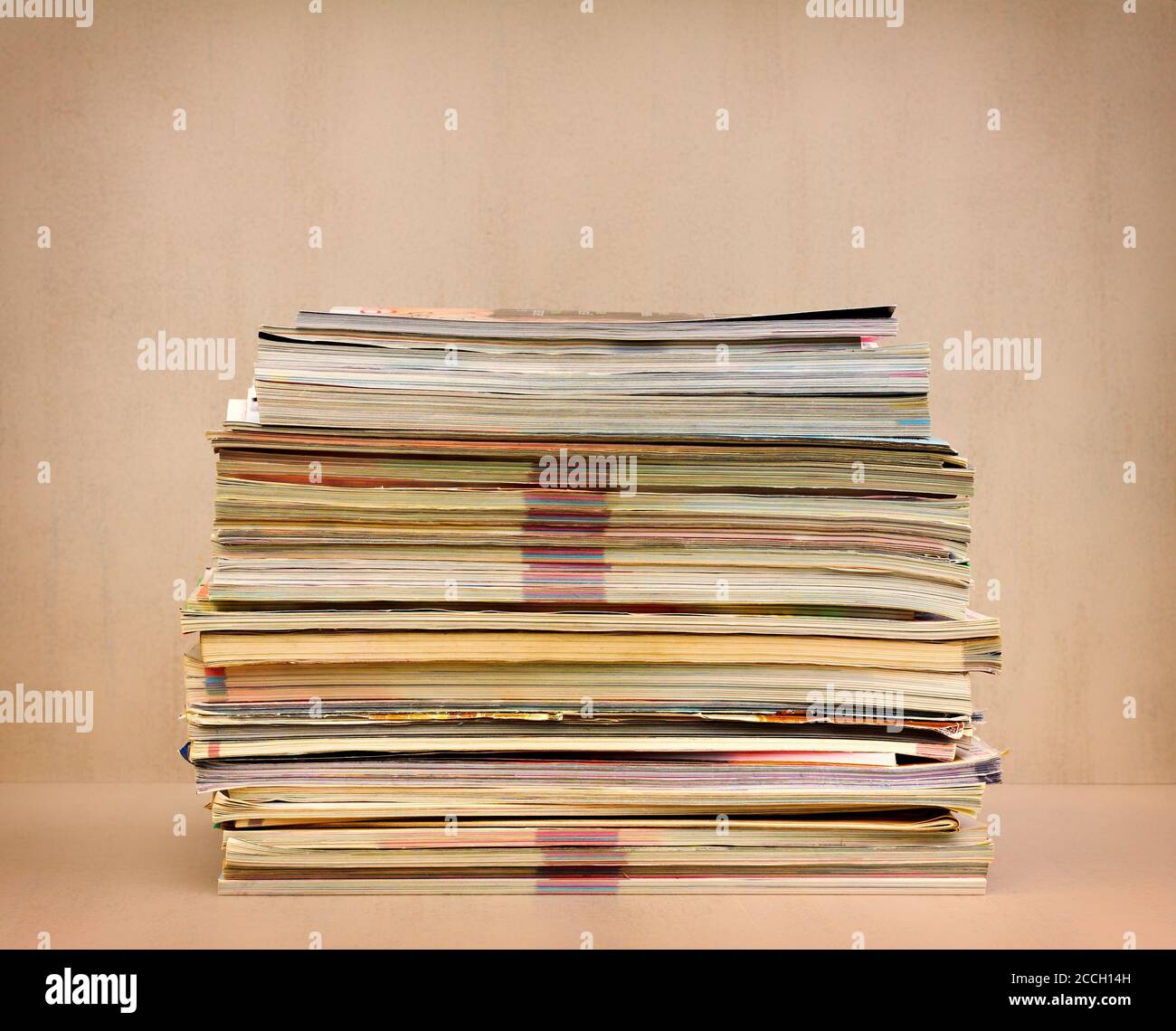 a large stack of magazines close-up, front view. toned photo Stock ...