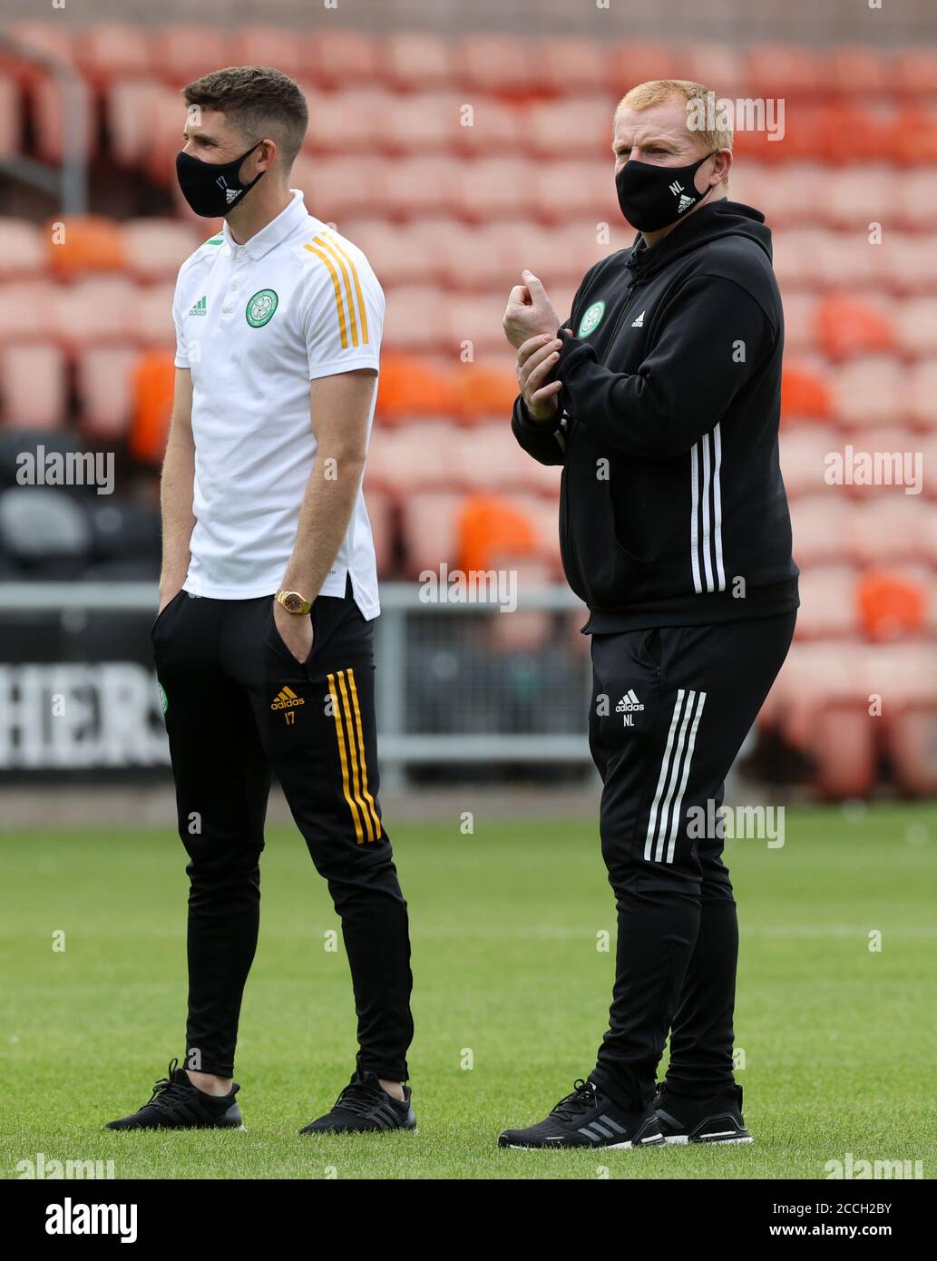 Celtic manager Neil Lennon (right) talks the pitch prior to the ...