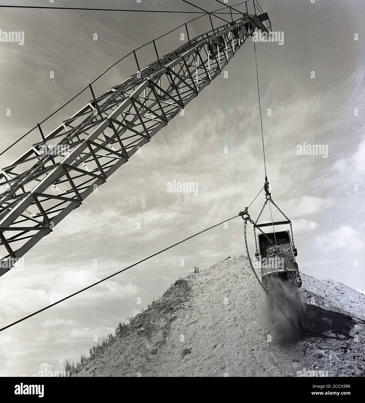 1950s, historical, earth exavation, a mechanical hoist with digging ...