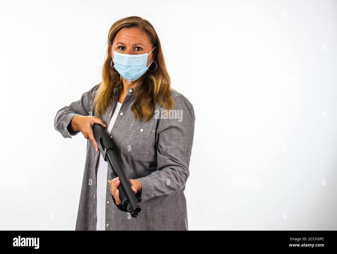 Woman With Face Mask During Covid-19 Armed With Pump Action Shotgun ...