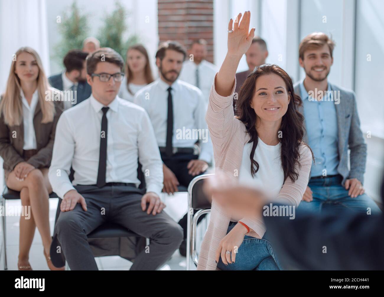 corporate team asks questions at a business meeting Stock Photo - Alamy