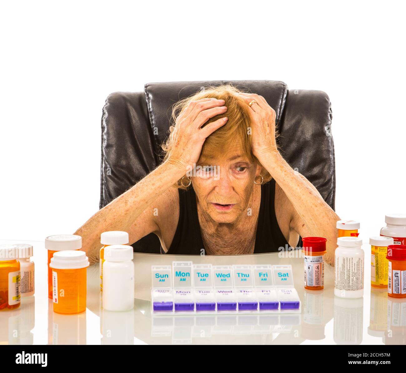 Senior Woman Overwhelmed Over Amount Of Pills For Her Pill Container ...