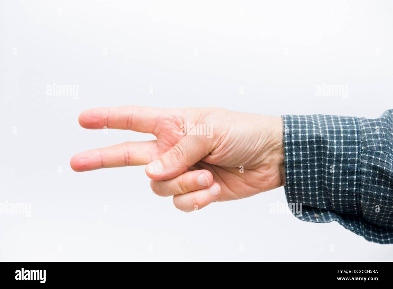 hand in gesture for the game of rock paper scissors,scissors gesture ...