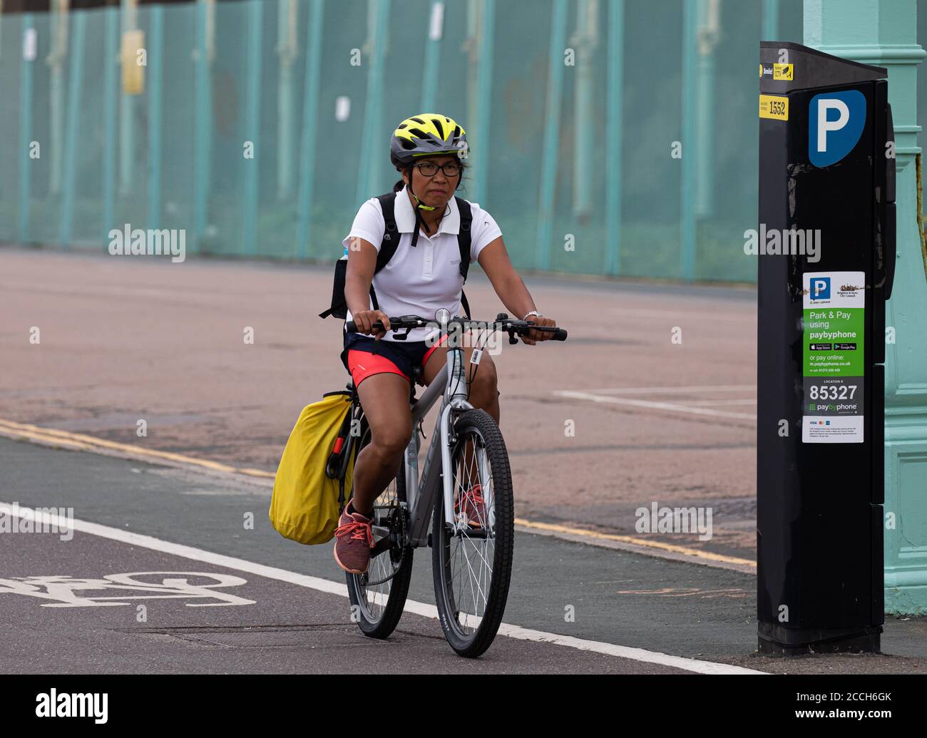 A lady riding a bike in Brighton, East Sussex, UK Stock Photo - Alamy