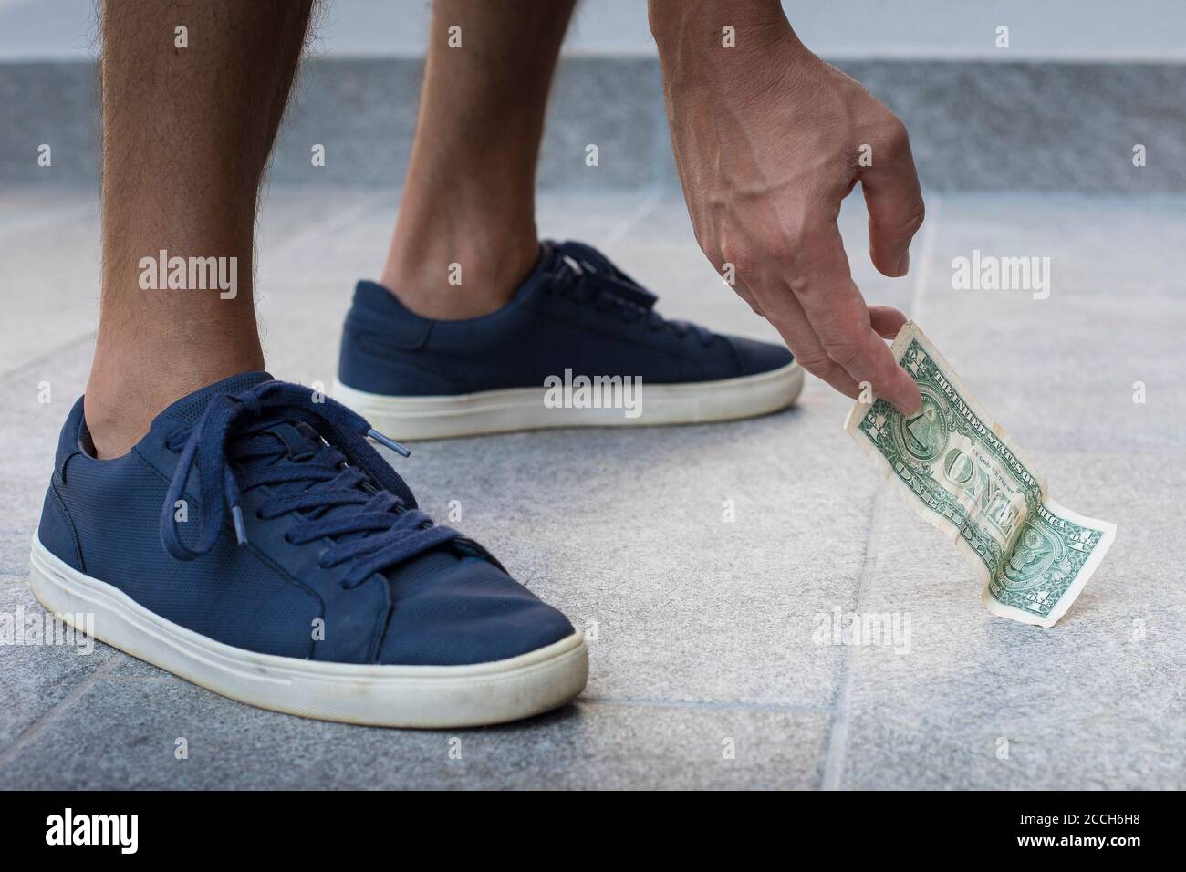 Picking up money floor hi-res stock photography and images - Alamy