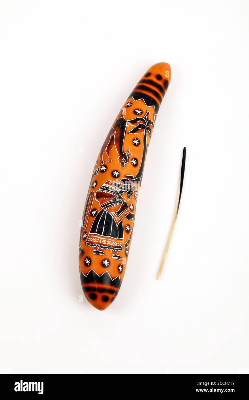 Highly decorated Gourd Guiro with a feather quill scraper. From Peru ...