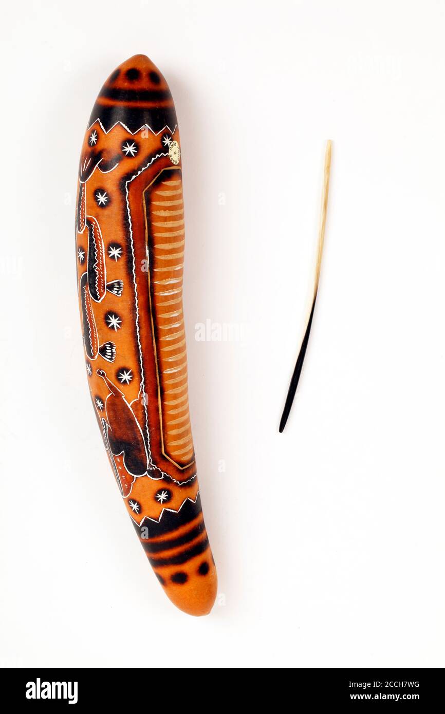 Highly decorated Gourd Guiro with a feather quill scraper. From Peru ...