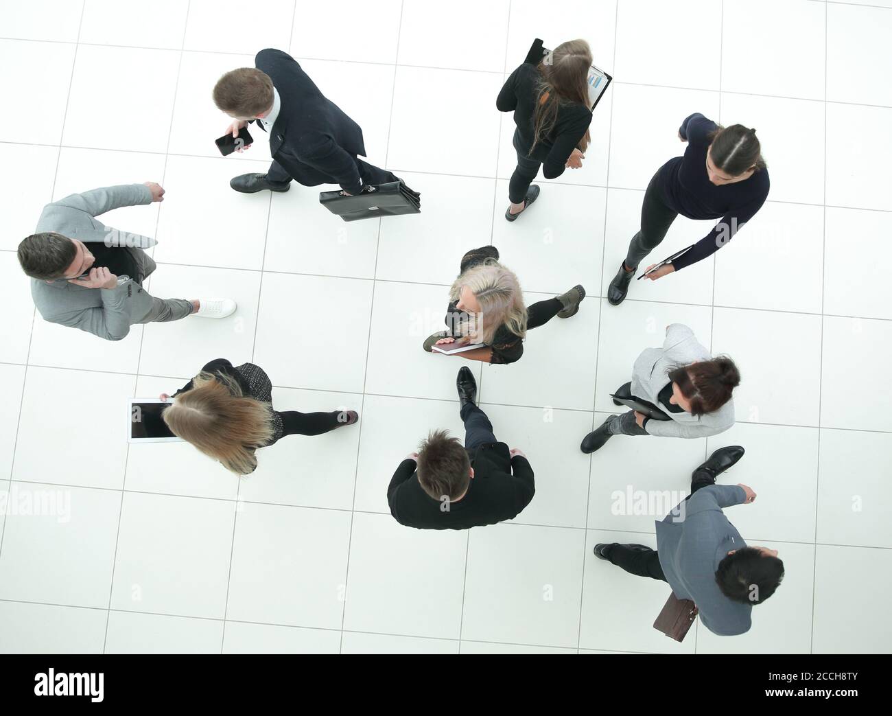 top view. group of serious diverse business people looking at the ...