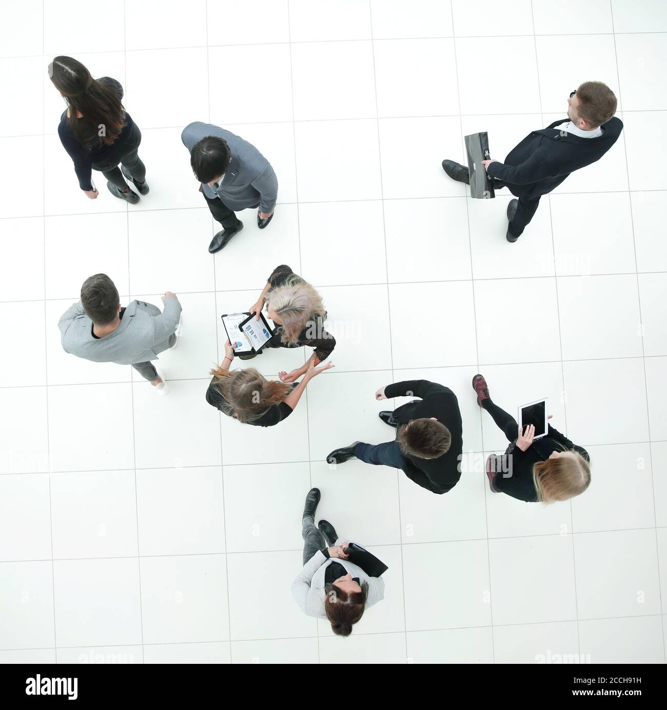 top view. group of serious diverse business people looking at the ...
