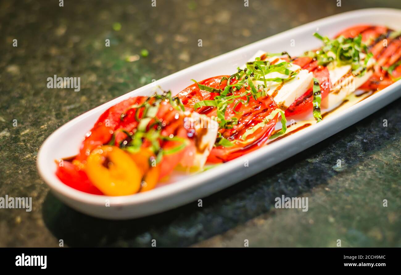Classic italian caprese salad with tomatoes hi-res stock photography ...