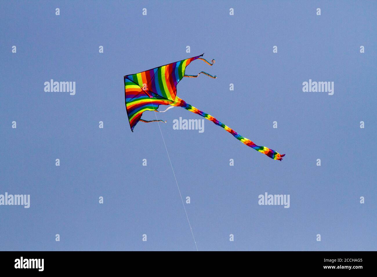 Children's favorite toy kite on windy days in spring, blue sky and ...