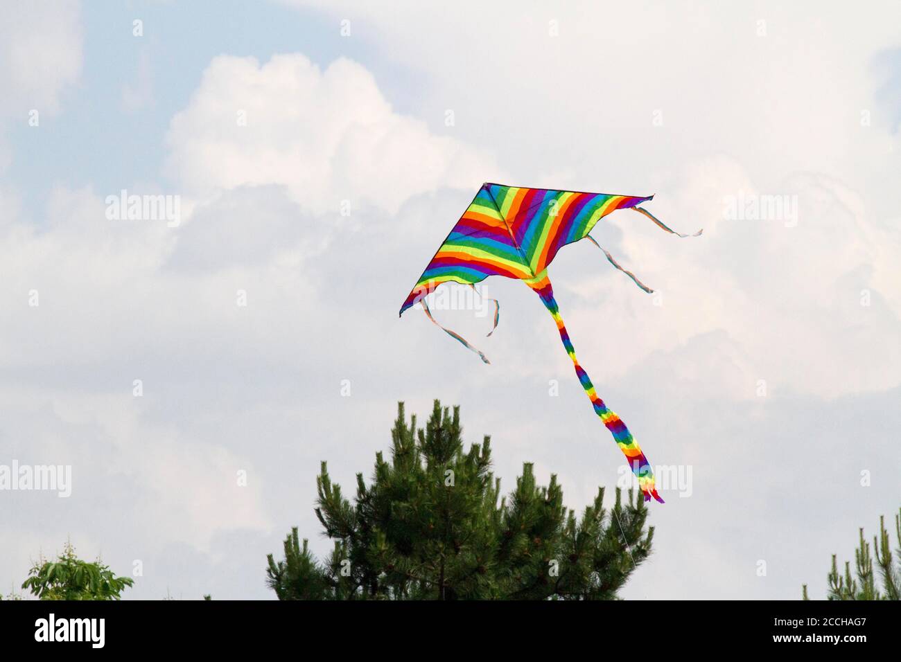 Children's favorite toy kite on windy days in spring, blue sky and ...