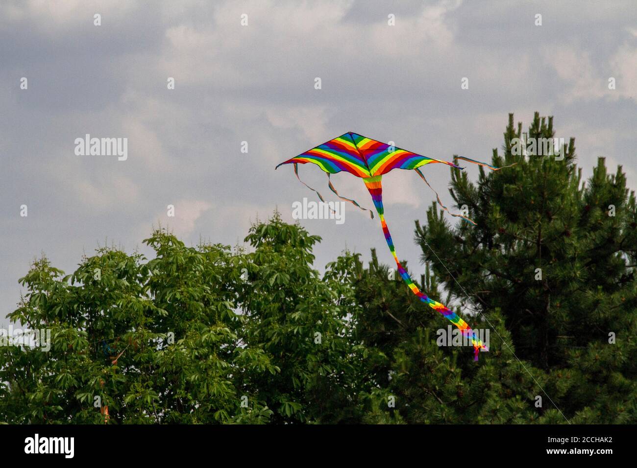 Children's favorite toy kite on windy days in spring, blue sky and ...