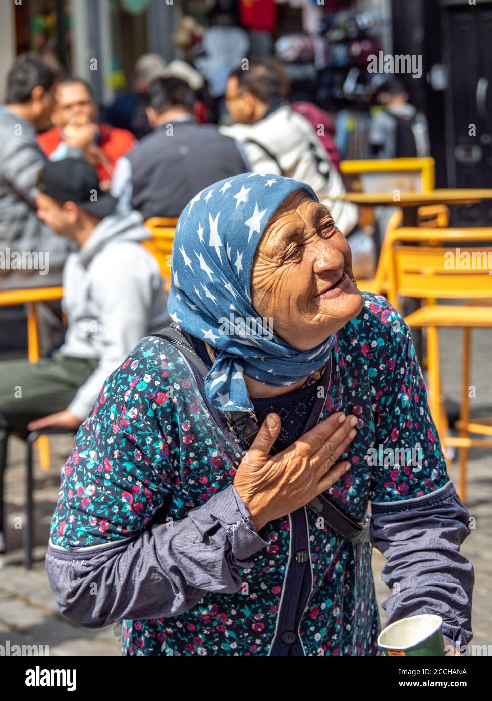 Old woman expresses thanks for donation on streets of Brussels Stock ...