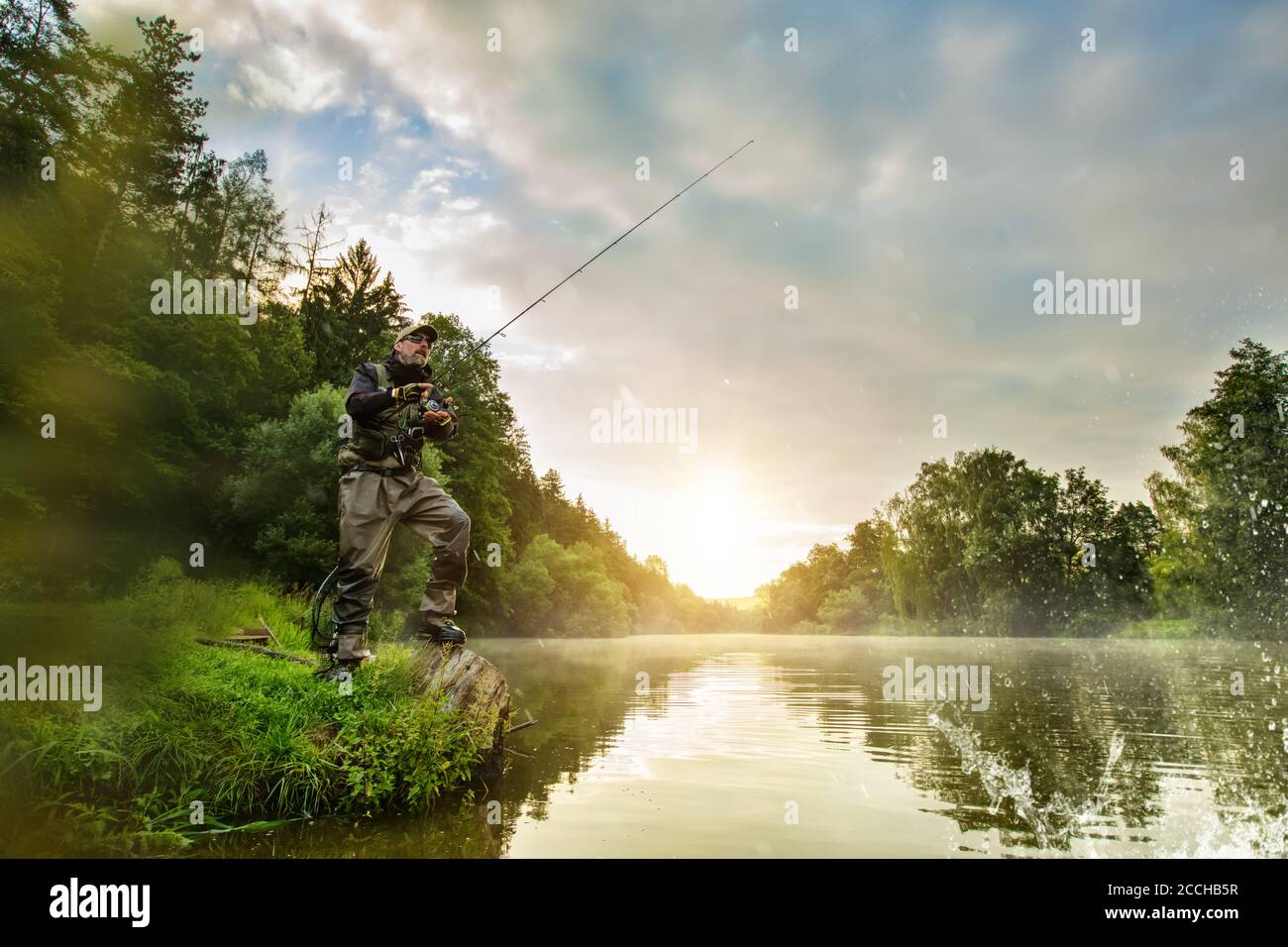 Sport fisherman hunting predator fish. Outdoor fishing in river during ...