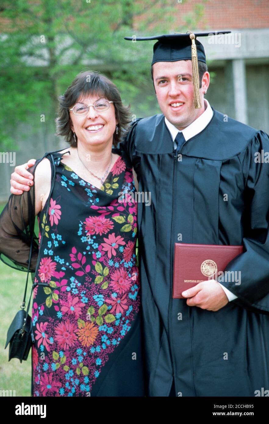 College graduate poses with his Mother at His Graduation, USA Stock ...
