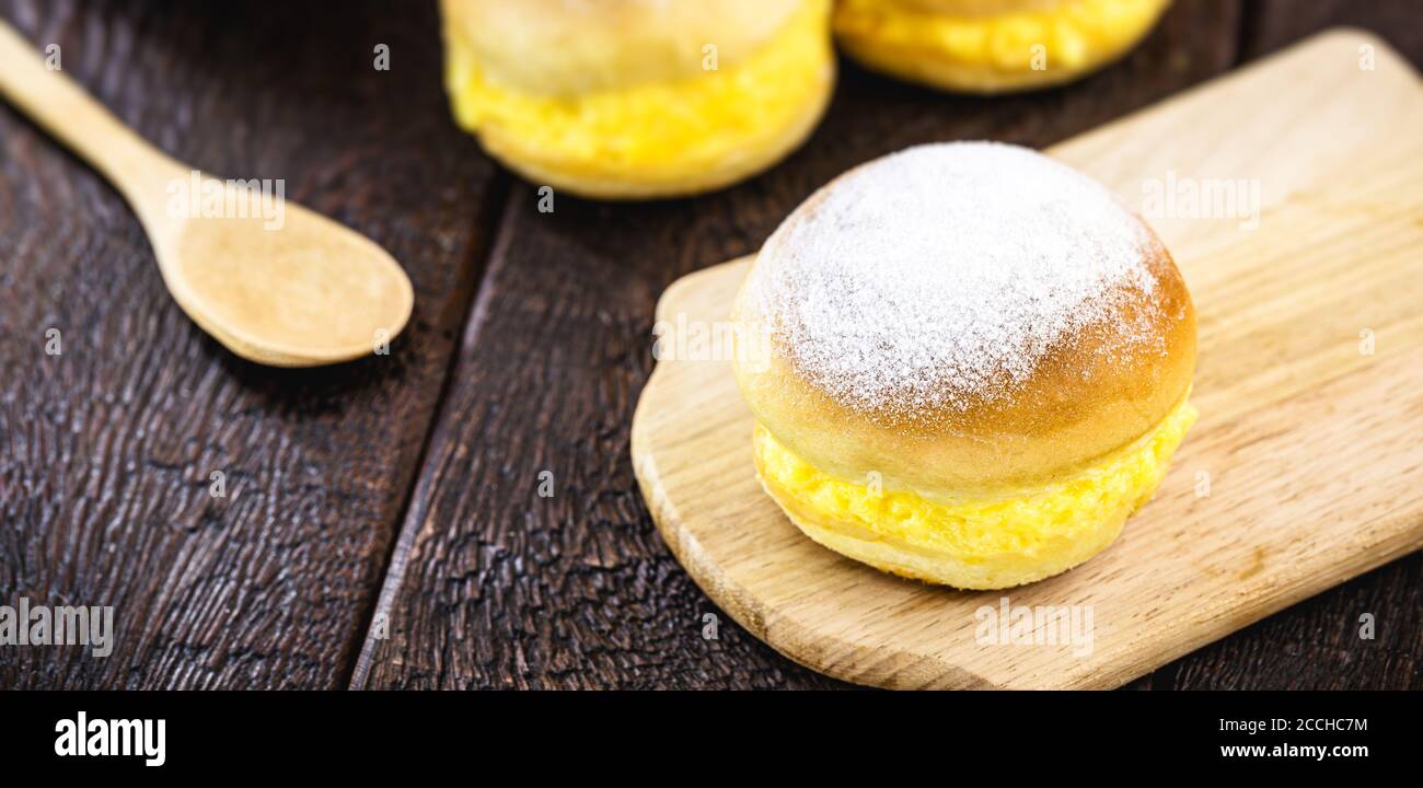 bread with cream and sugar, Brazilian donut called "bakery dream", or ...