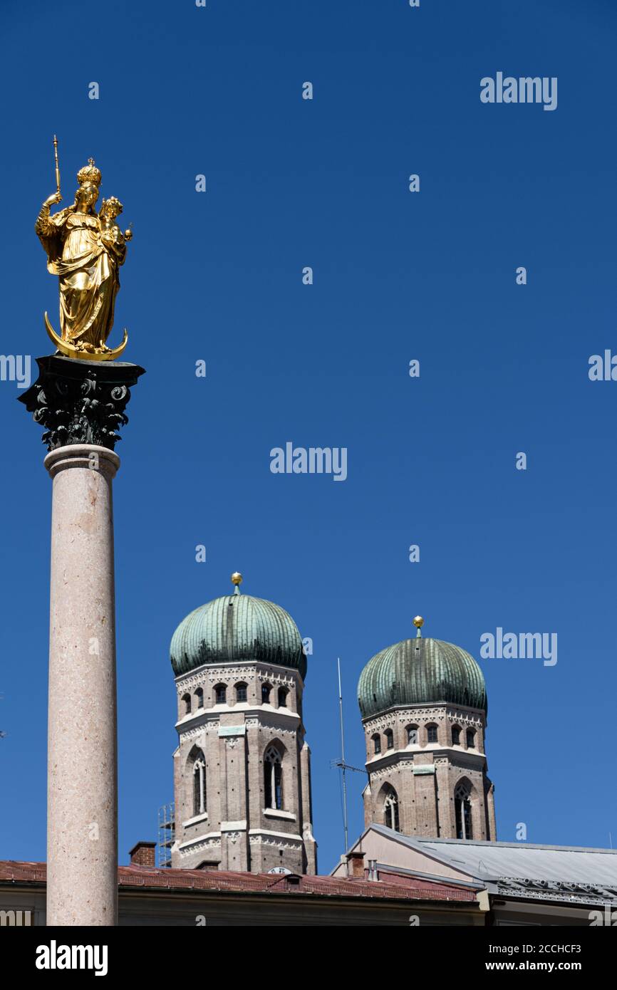 Marienplatz, Munich, Germany; Marienstatue (Statue of Mary), towers of ...