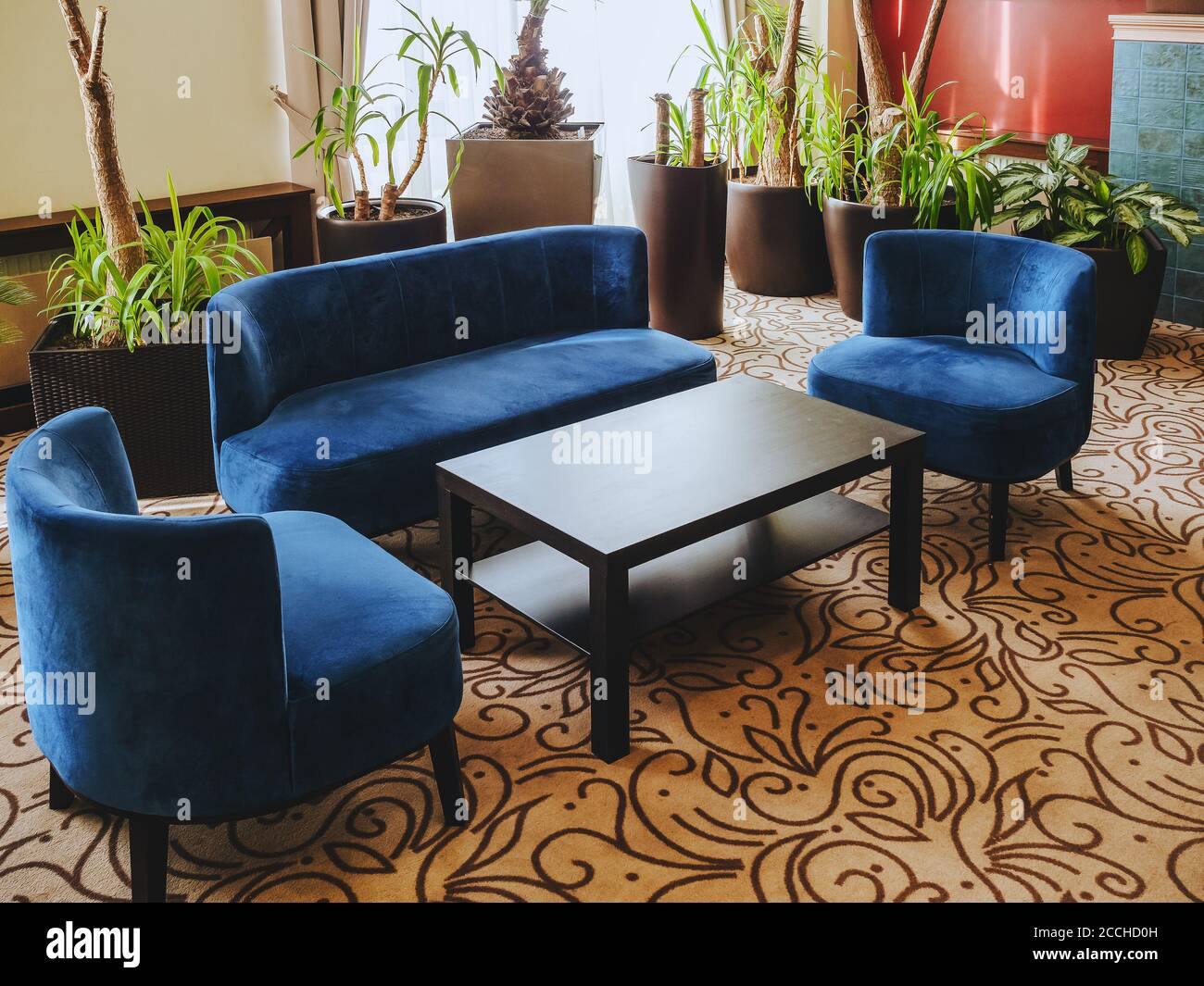 Sochi, Russia - 25 February 2020. Hotel lobby with blue velvet sofa and ...