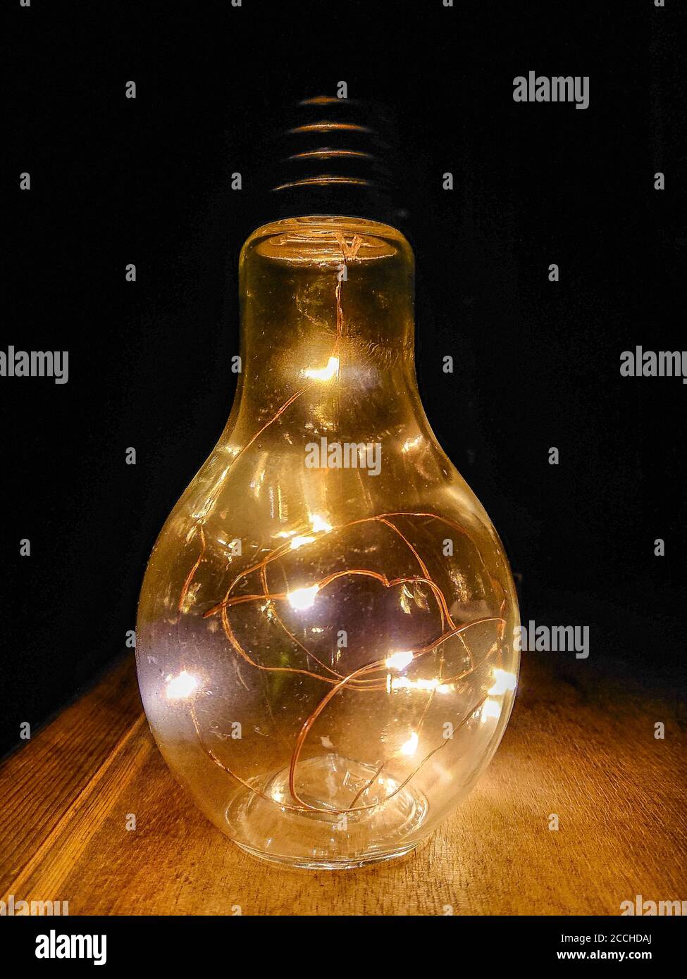 A glas bulb shining with little LED lights Stock Photo - Alamy